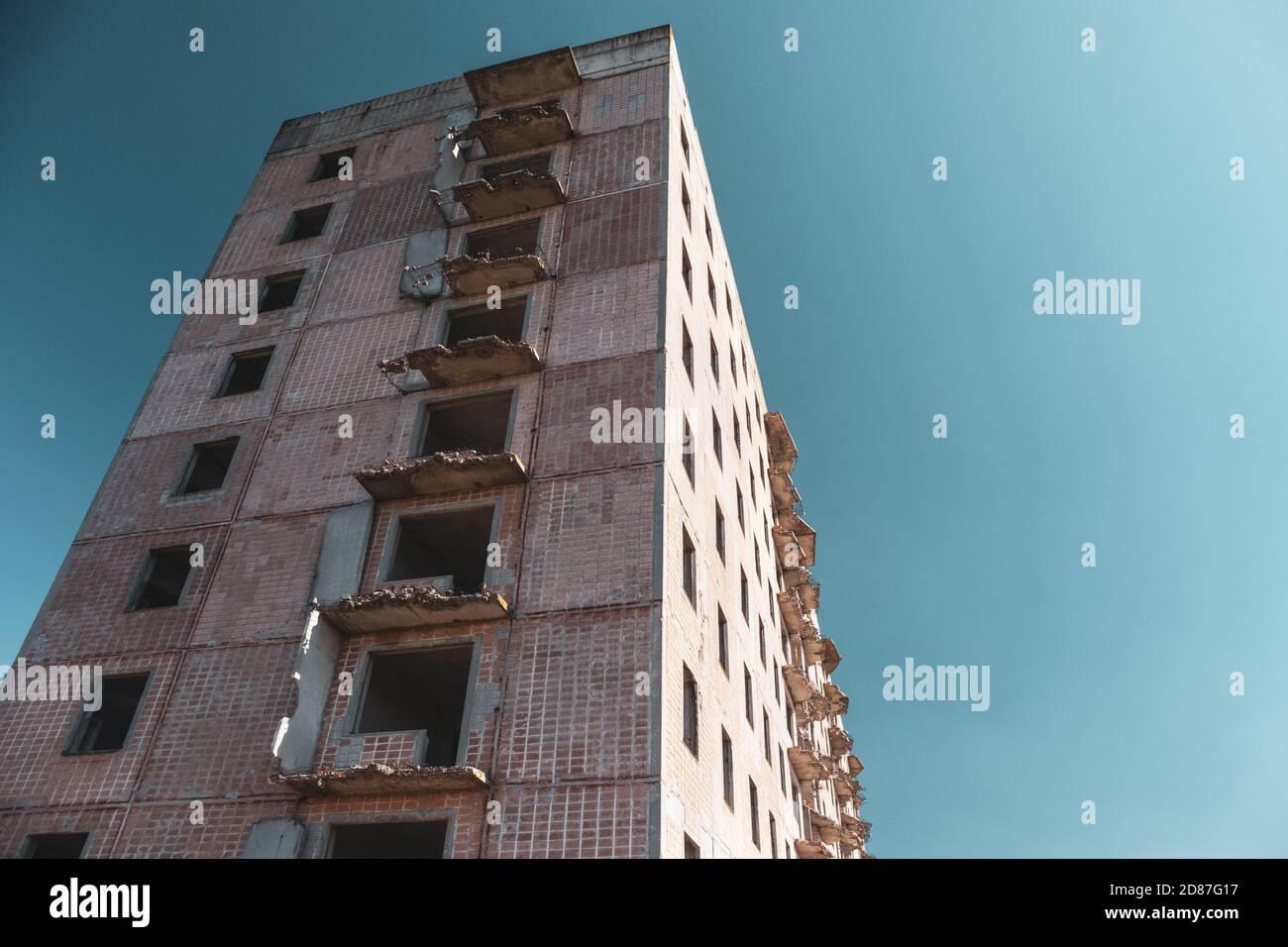 High multistorey abandoned soviet building facade with crashed ...