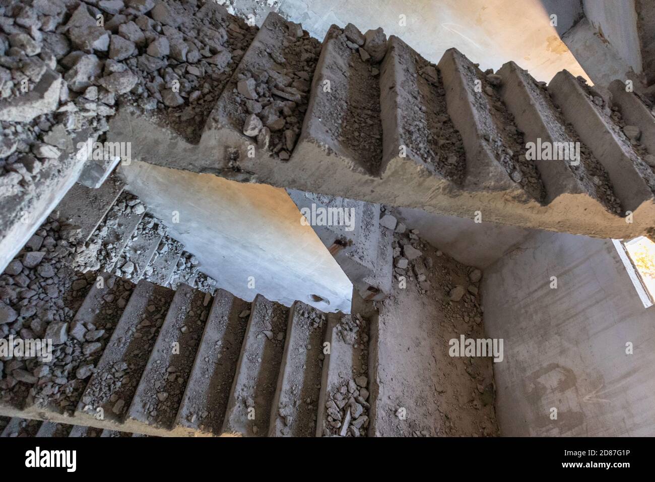 Weathered concrete crashed staircase inside abandoned ruined floor of ...