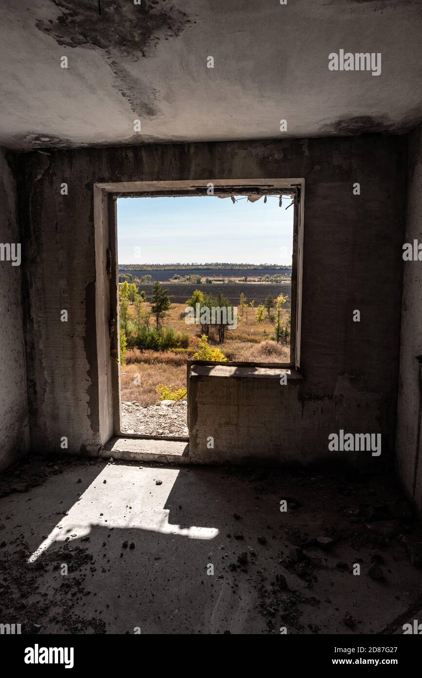 Sun shining through window way into old dark cold weathered abandoned ...