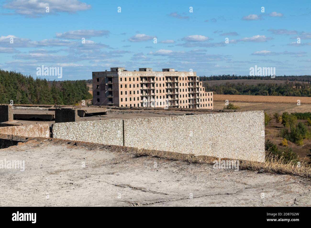 View from concrete roof of high multistorey abandoned soviet building ...