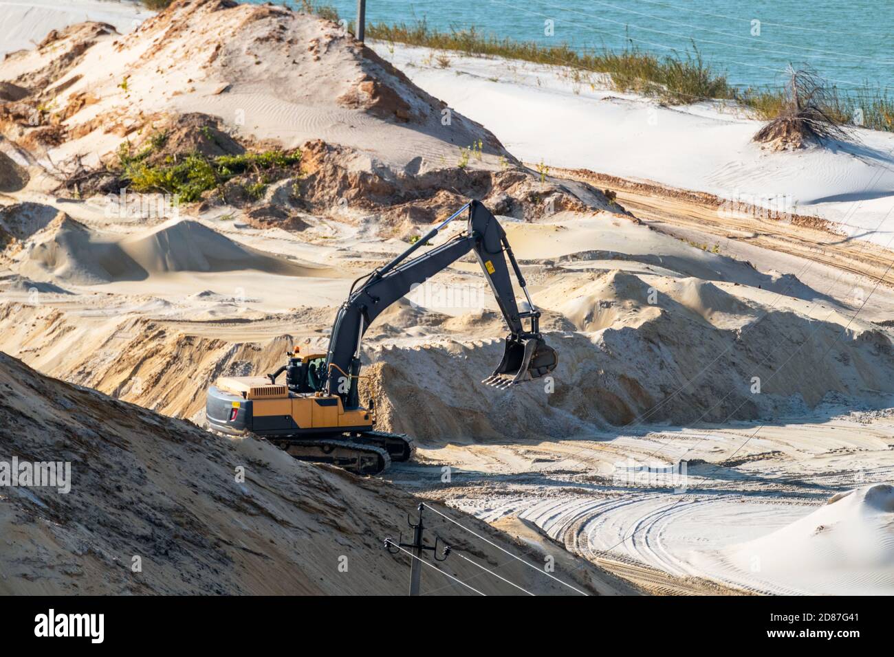 Sand extraction with machinery excavator at quartz quarry close-up ...