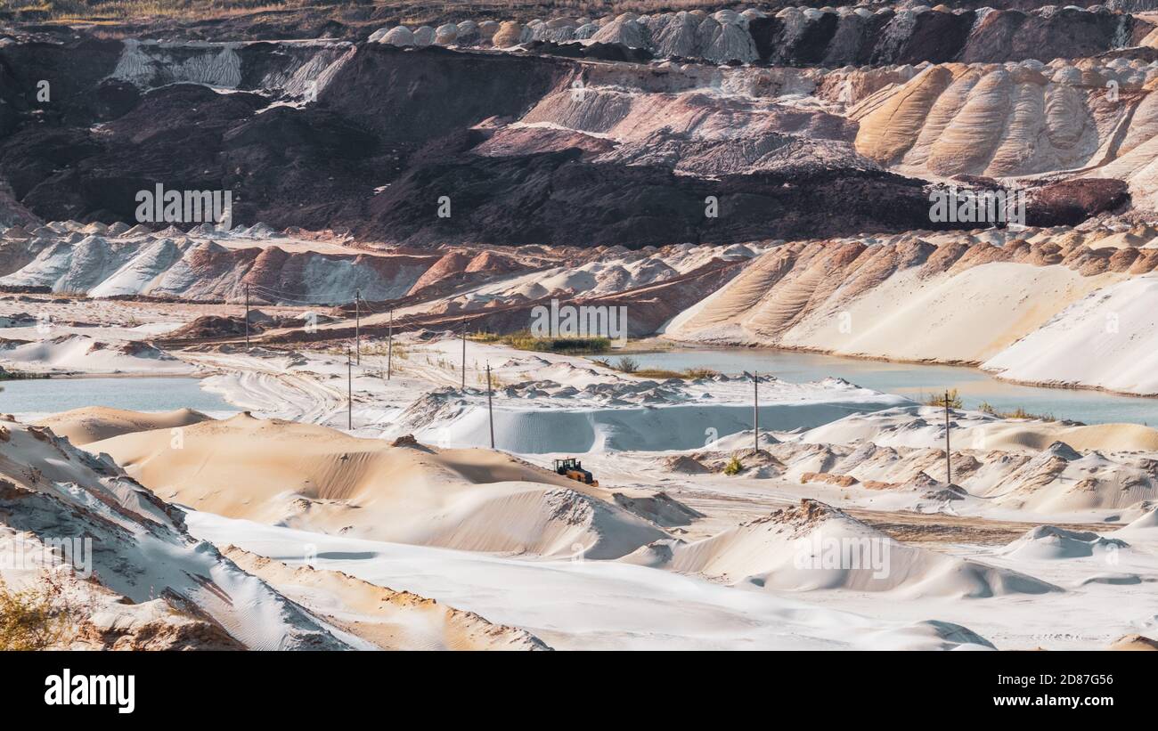 Landscape of sand extraction at quartz quarry. Sand dunes hills terrain ...