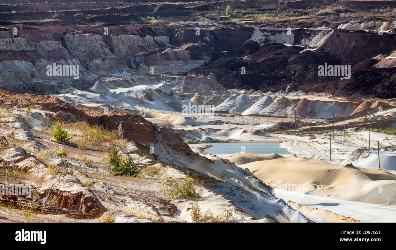 Landscape of sand extraction at quartz quarry. Sand dunes hills terrain ...