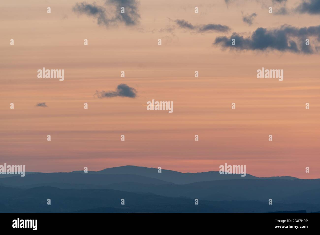 Landscape sunset colors over mountains and hills orange red yellow blue ...