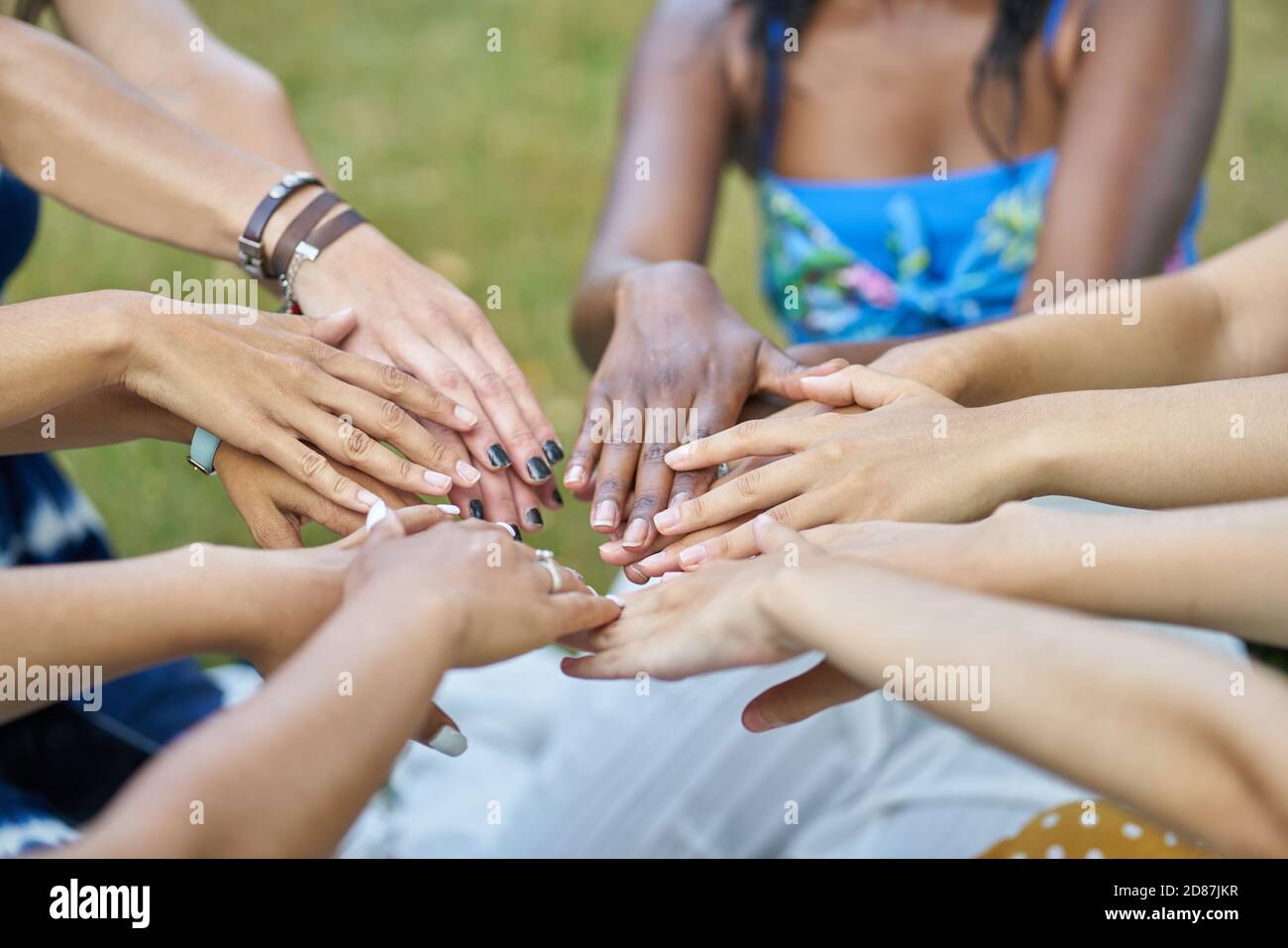 Group people joining hands in hi-res stock photography and images - Alamy