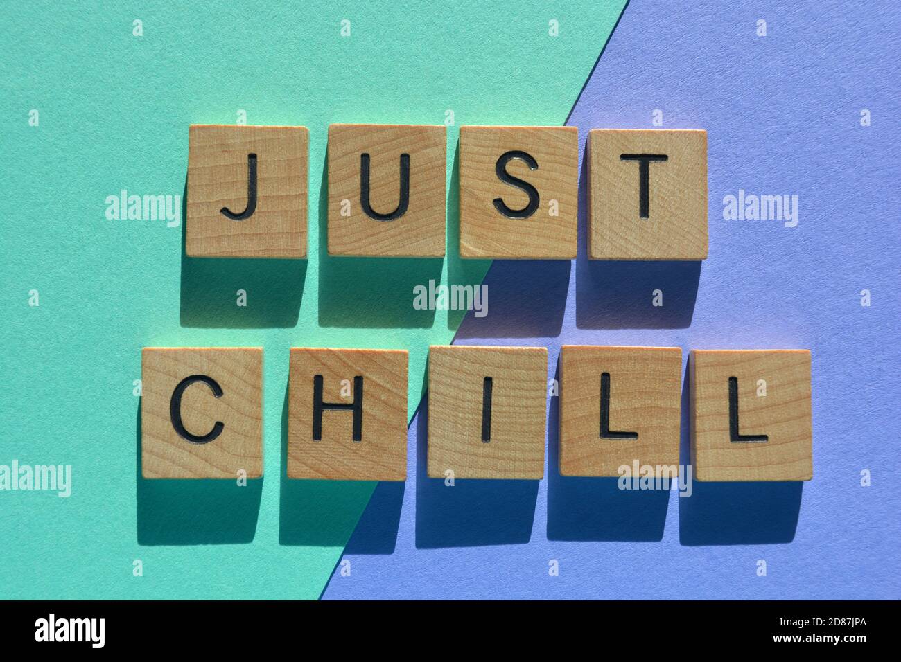 Just Chill, words in wooden alphabet ltetters isolated on colourful ...