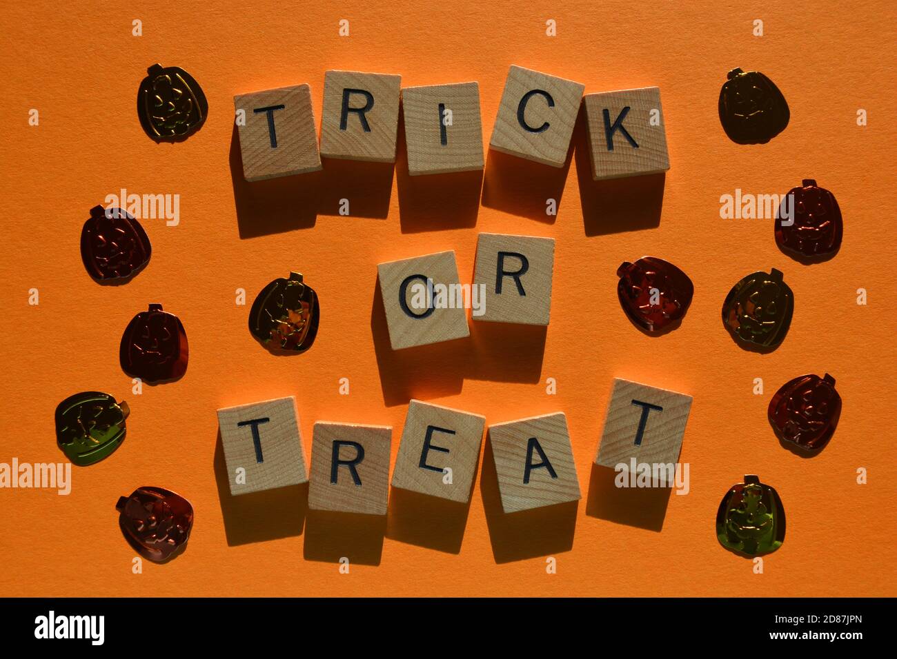 Trick or Treat, words in wooden alphabet letters surrounded by ...