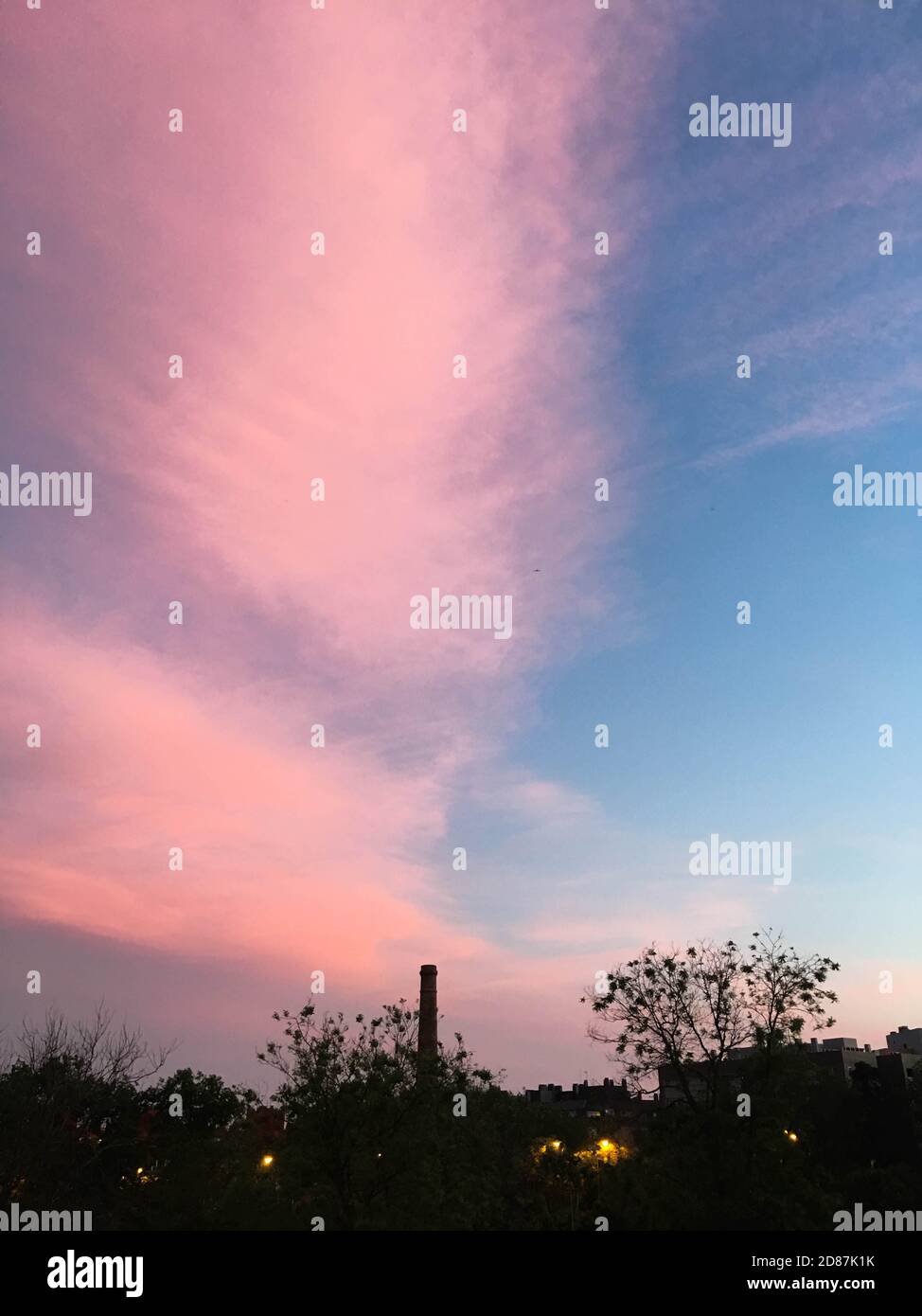 fireplace with pink sunset in madrid with lit streetlights Stock Photo ...