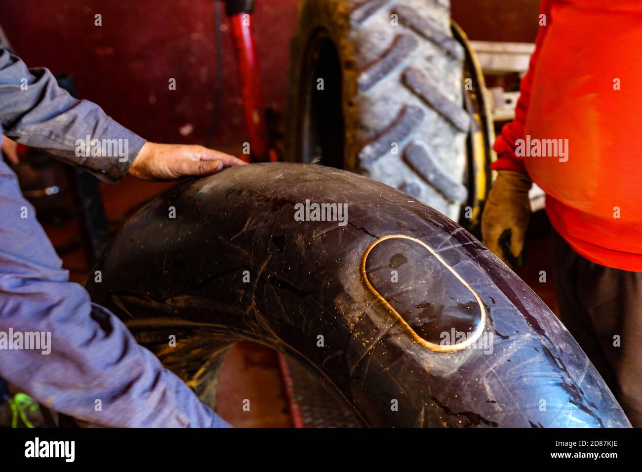 Tractor wheel tube patch, with bottom wheel Stock Photo - Alamy