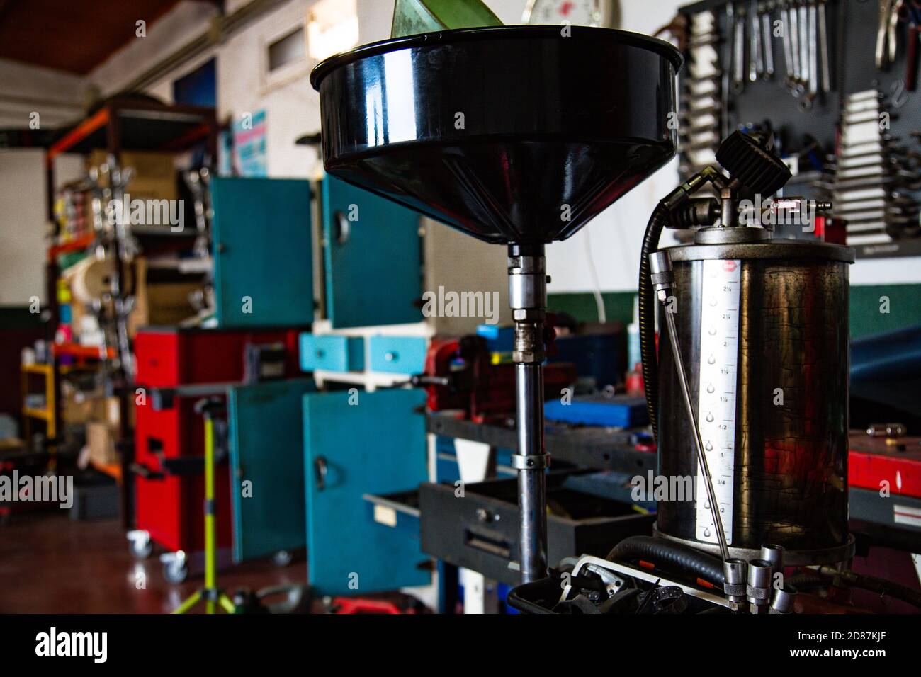Funnel for oil extraction from mechanical workshop Stock Photo - Alamy