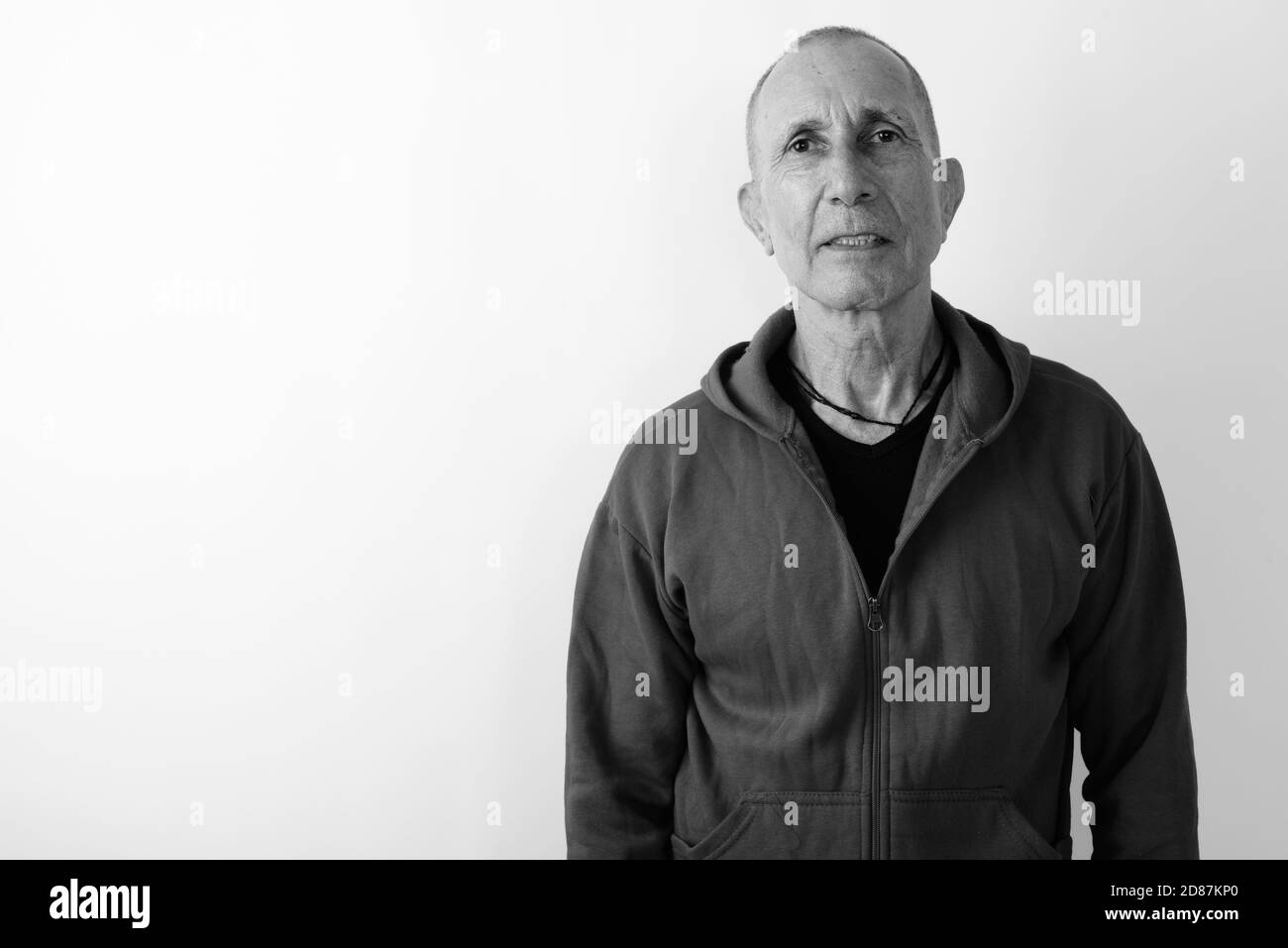 Studio shot of bald senior man against white background Stock Photo - Alamy