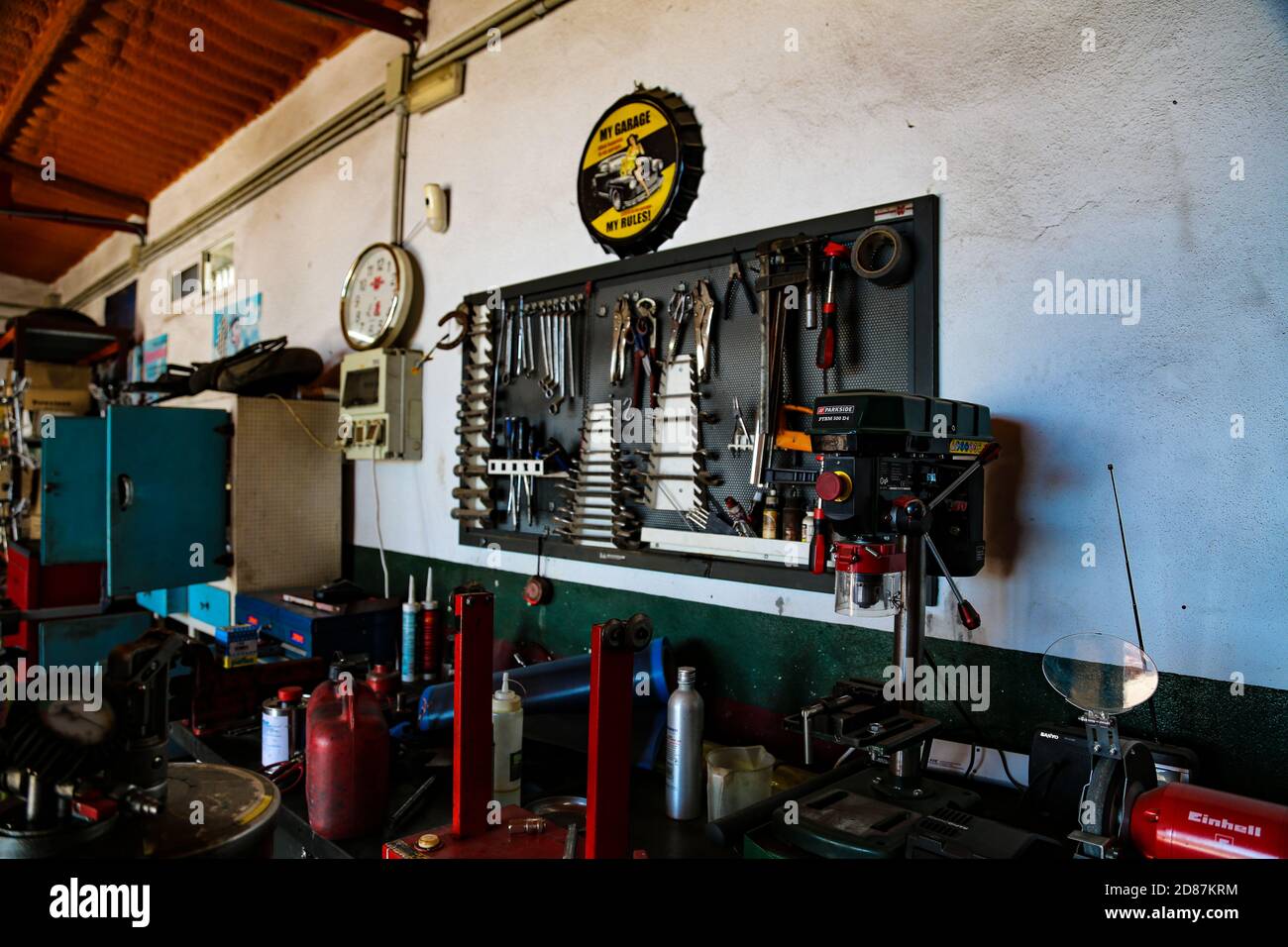 Tool panel above work table full of things Stock Photo - Alamy