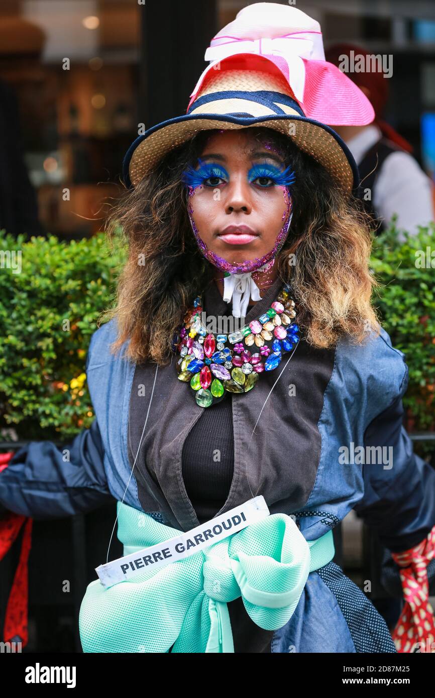 London, UK. 24 October 2020. Model take part in a flash mob fashion ...