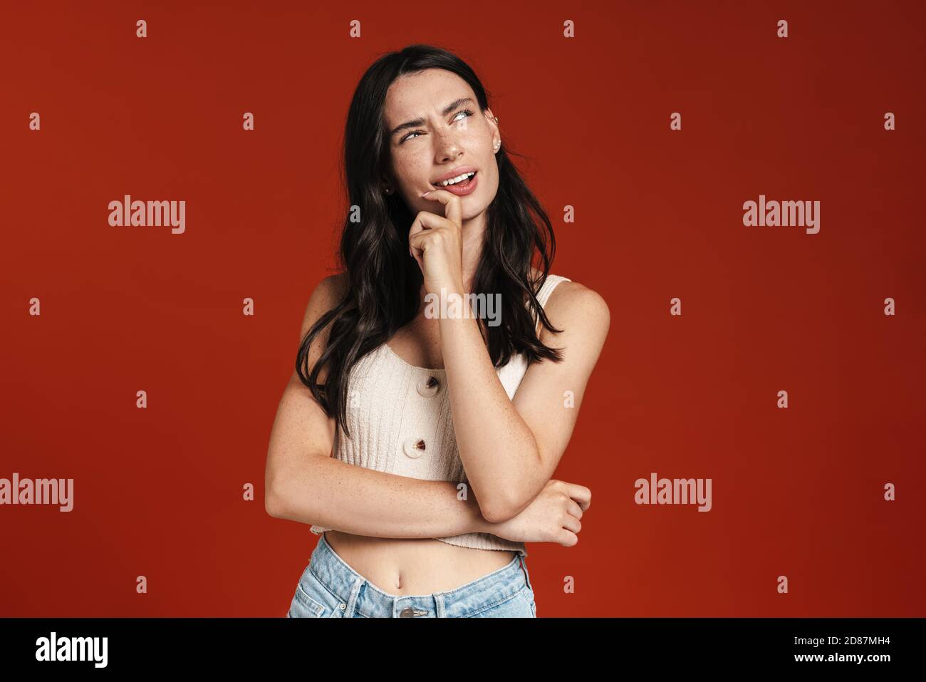 Image of nice brooding woman thinking and looking aside isolated over ...