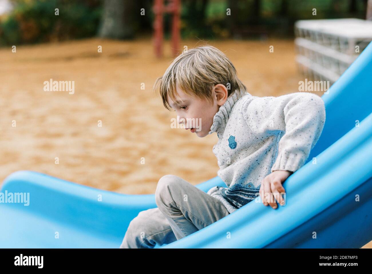 Blonde child slide hi-res stock photography and images - Alamy