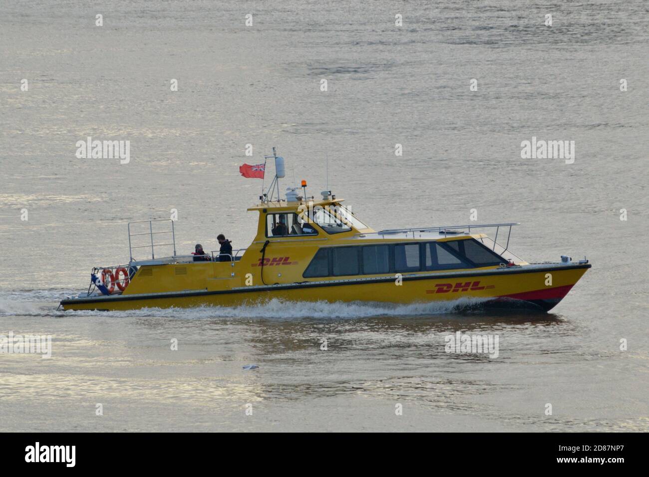 DHL Express parcel delivery service on the Thames in London Stock Photo ...