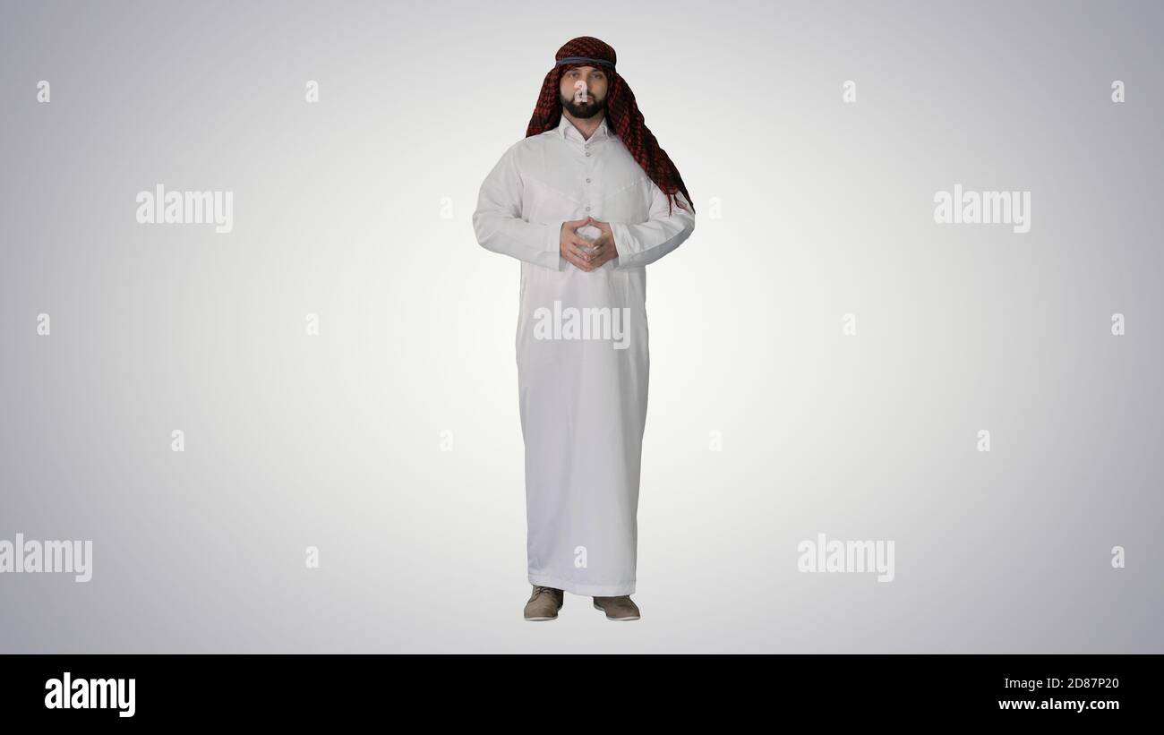 Sheikh standing and telling a story on gradient background Stock Photo ...
