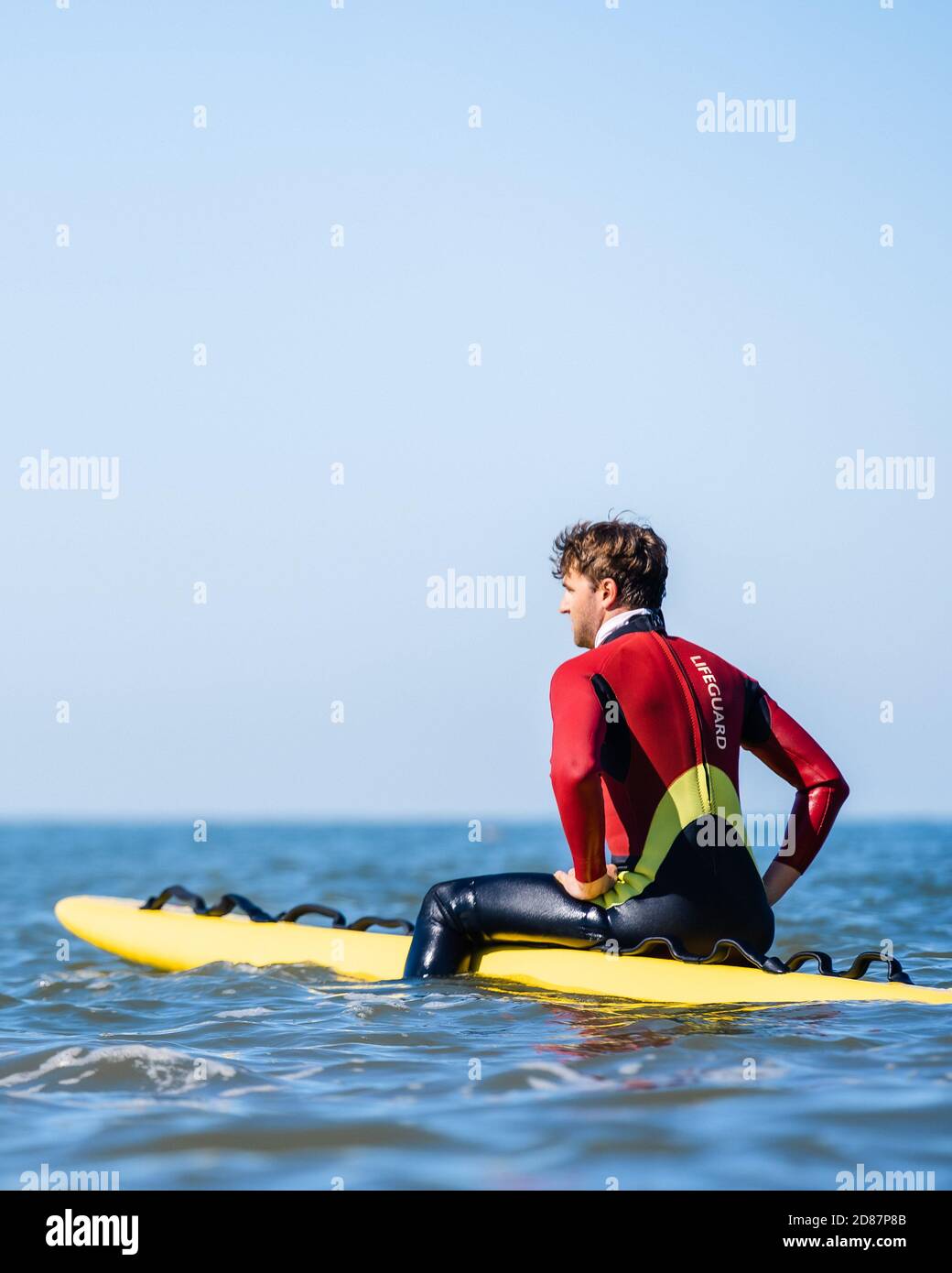 Beach Lifeguard looking out to sea Stock Photo - Alamy