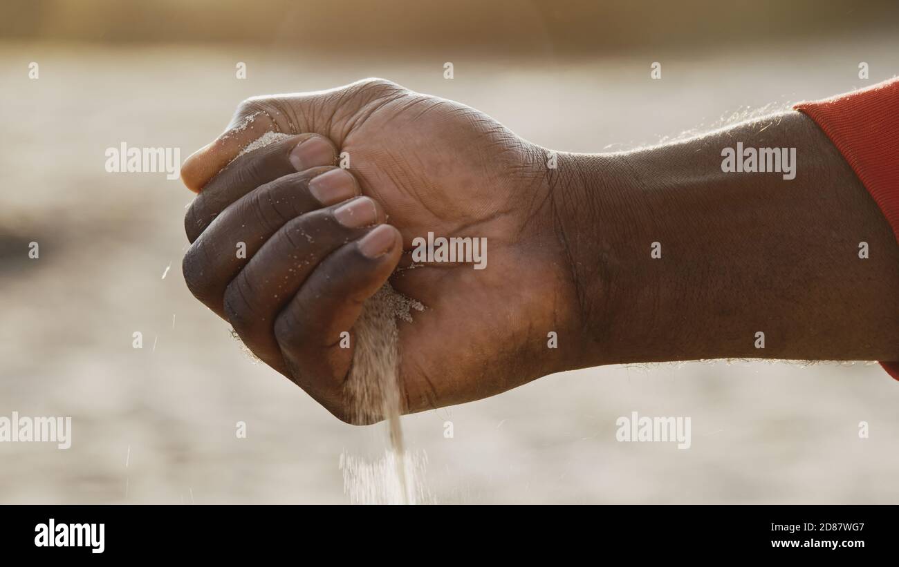 Hand Pouring Sand High Resolution Stock Photography and Images - Alamy