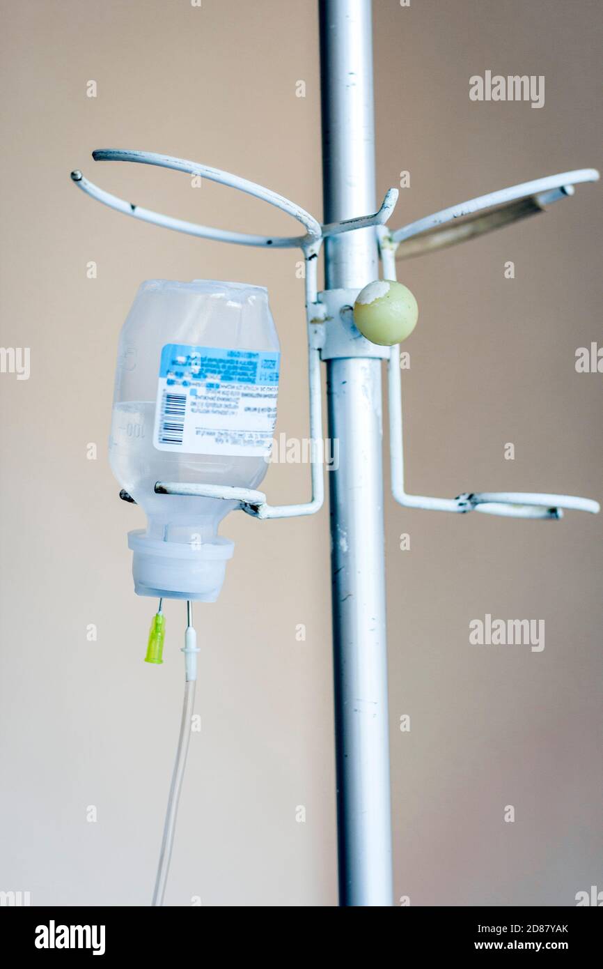 Close-up bottle of medicine on dropper system in the operating room ...