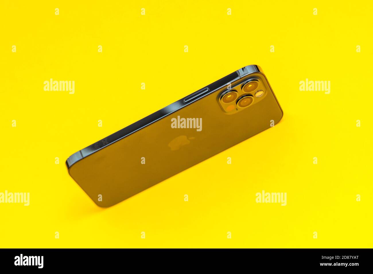 Paris, France - Oct 23, 2020: Yellow background with new iPhone 12 Pro ...