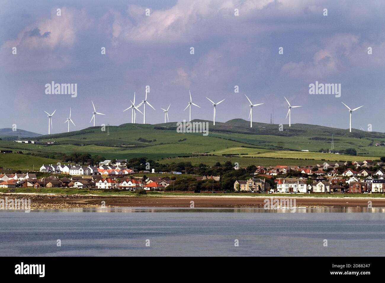 Scotland. Ardrossan with a wind-farm on the hills behind the town ...
