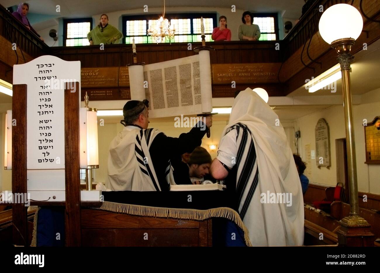 The Torah is held high for all to see during the Jewish festival of ...