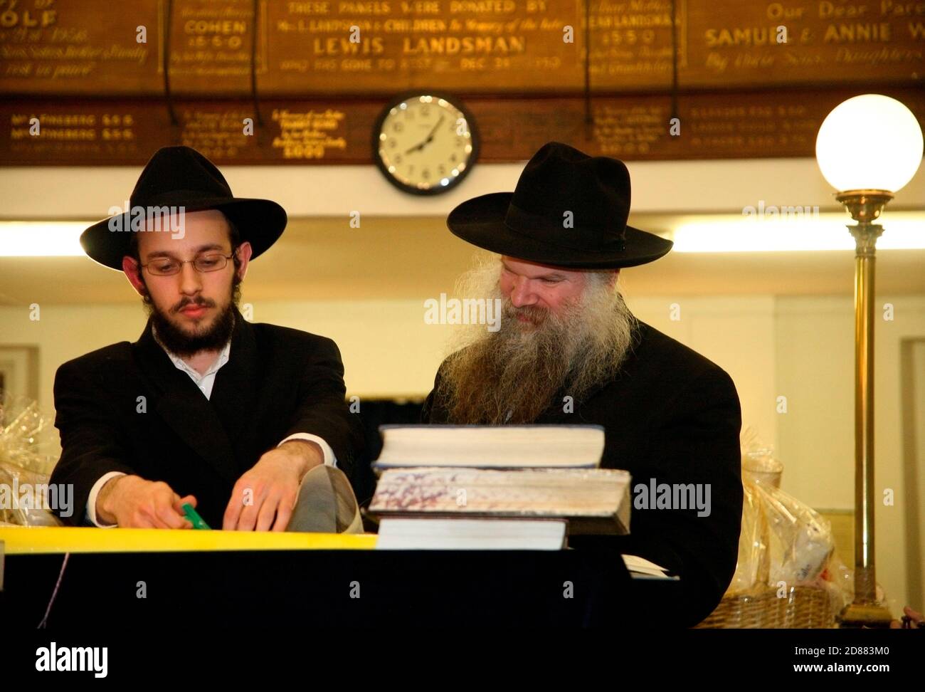 Rabbi reading from the book of Esther during Purim Stock Photo - Alamy