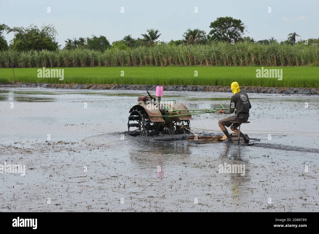 Nakhon Pathom, Thailand-July 21 : farmer and his machine working on ...