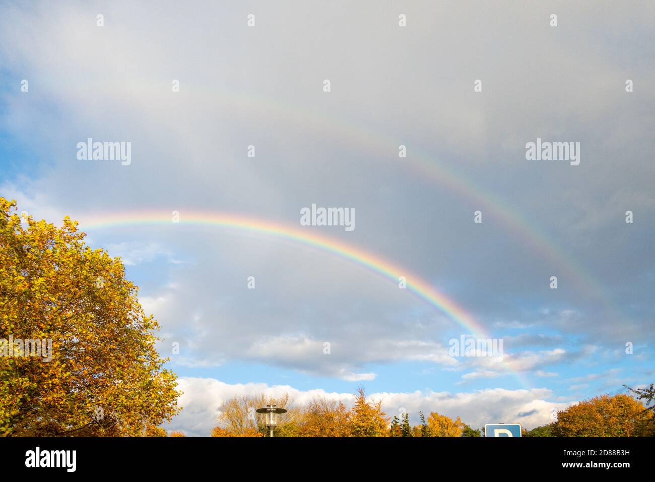 a big colorful rainbow is in the sky Stock Photo - Alamy
