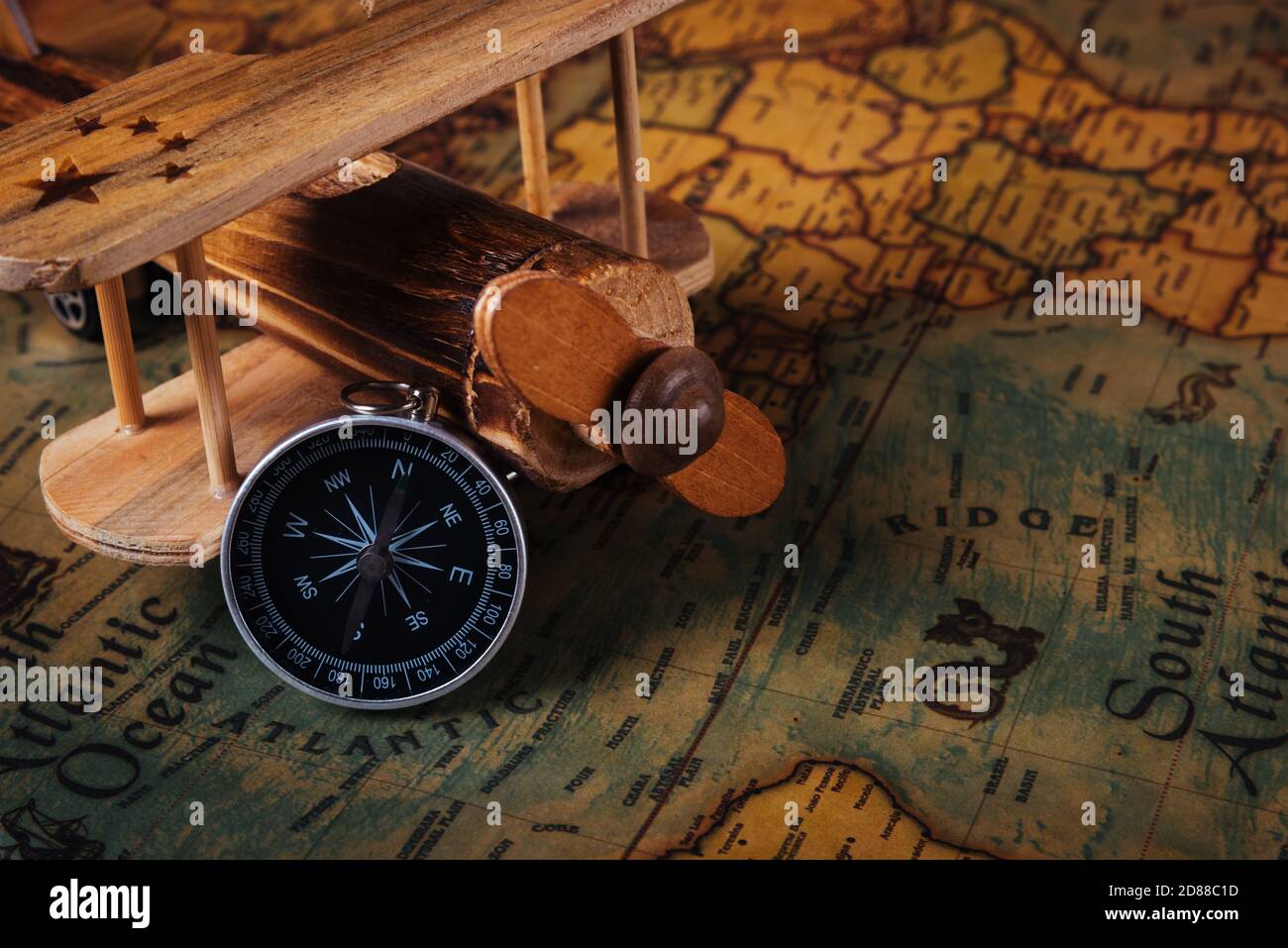 Old compass discovery and wooden plane on vintage paper antique world ...