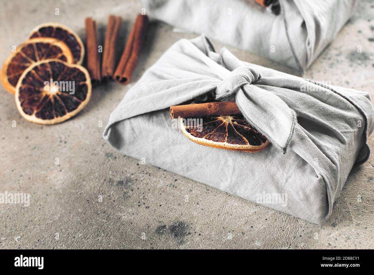 Holiday eco-friendly fabric reusable gift packaging with dry orange and ...