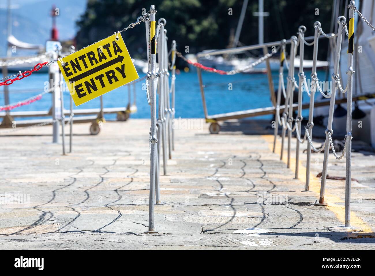 Entry into a corridor in a pier of an Italian port by the sea. No ...