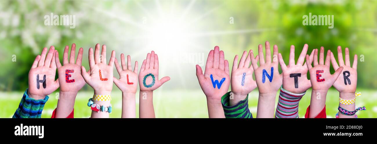 Children Hands Building Word Hello Winter, Grass Meadow Stock Photo - Alamy
