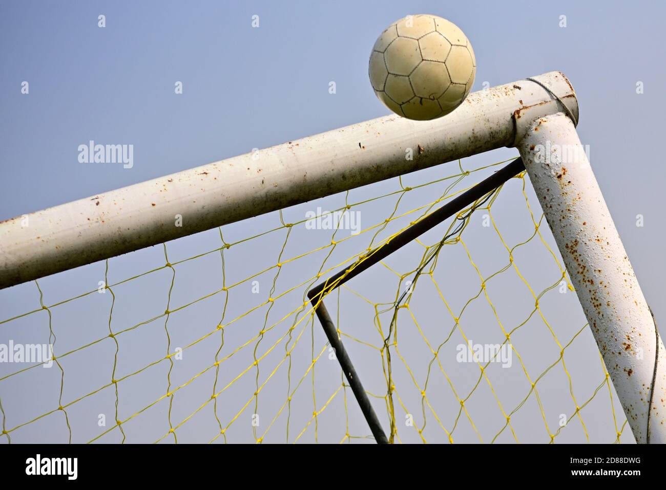 Scoring a goal, close-up of soccer ball tend to enter soccer goal ...