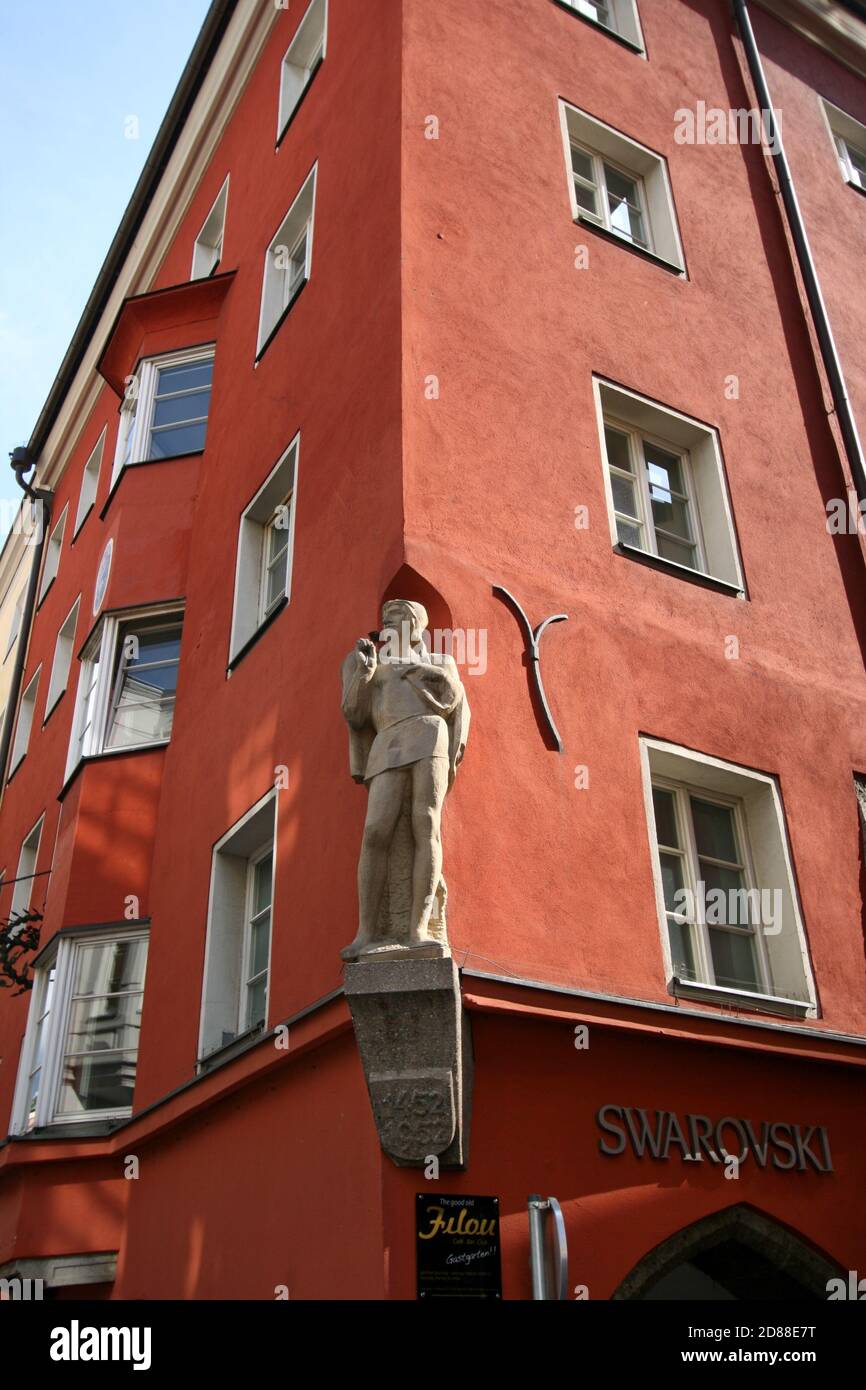 A medieval male figure adorns the corner of the Swarovski glass company ...