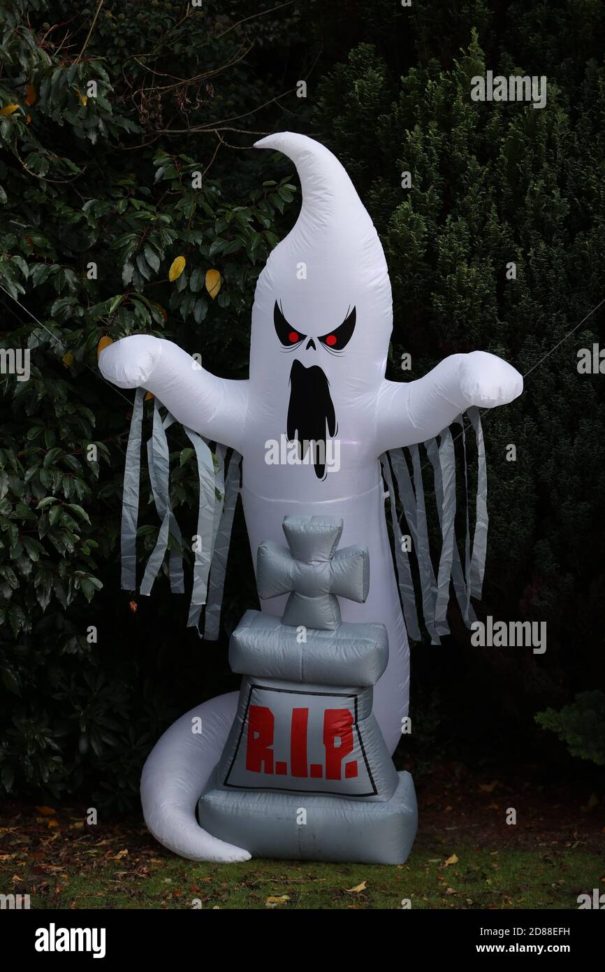 An inflatable ghost as part of Halloween decorations outside a house in ...