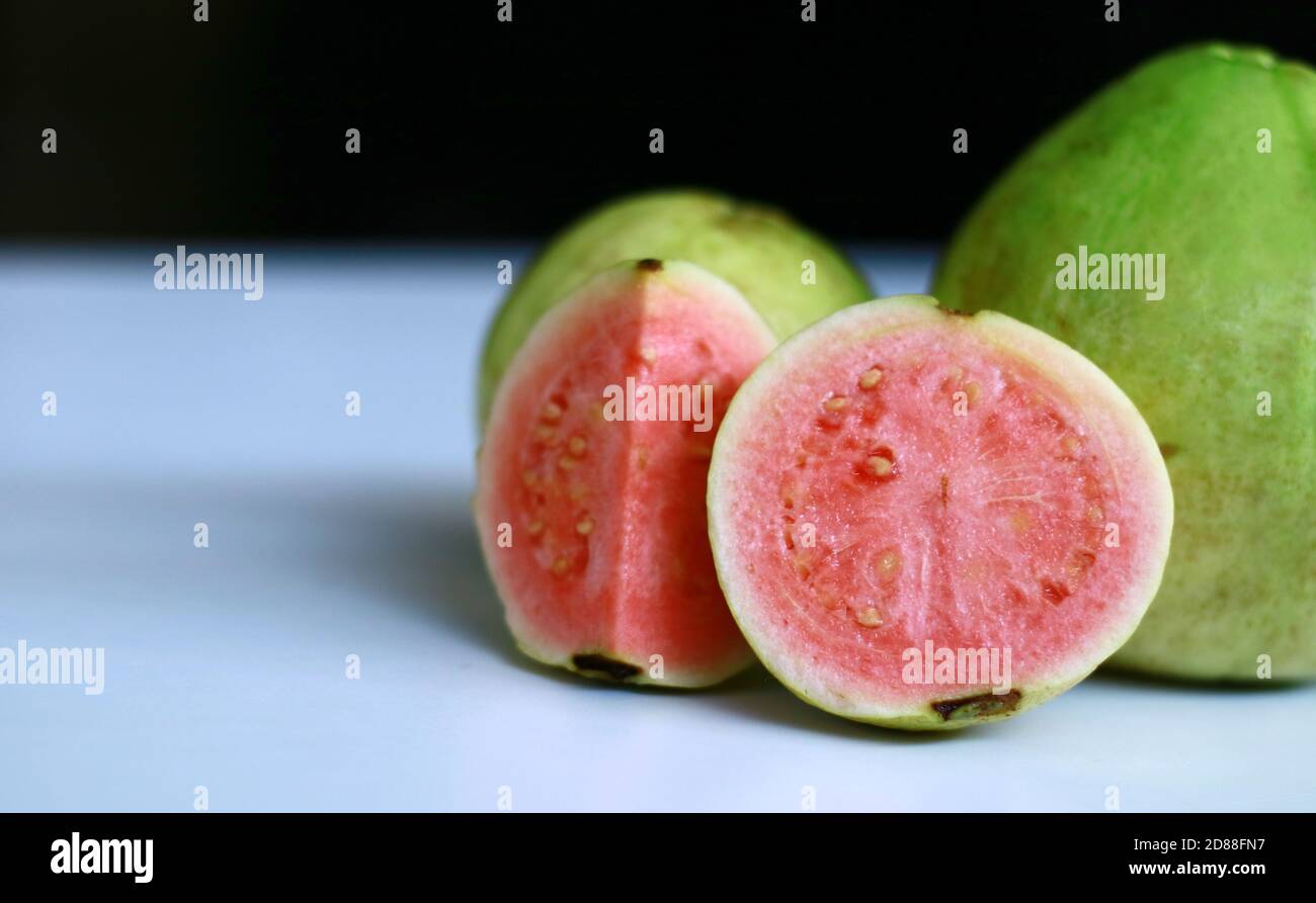 Red guava or common guava on white background Stock Photo - Alamy