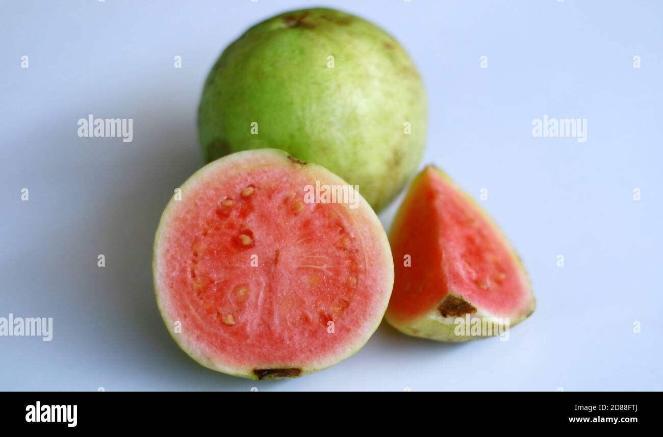 Red guava or common guava on white background Stock Photo - Alamy