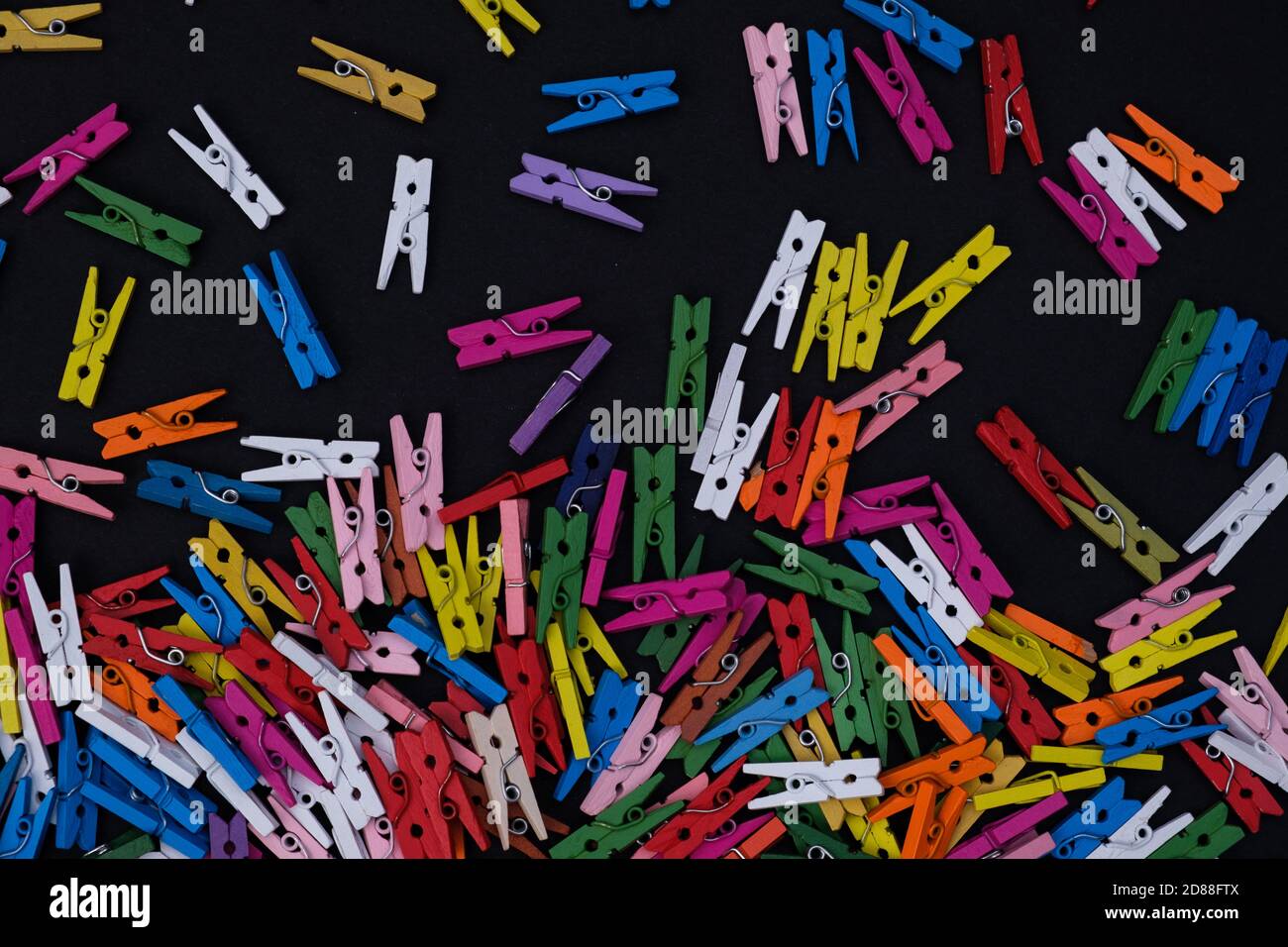 Colored wooden clothes pegs on black background, colorful banner Stock ...