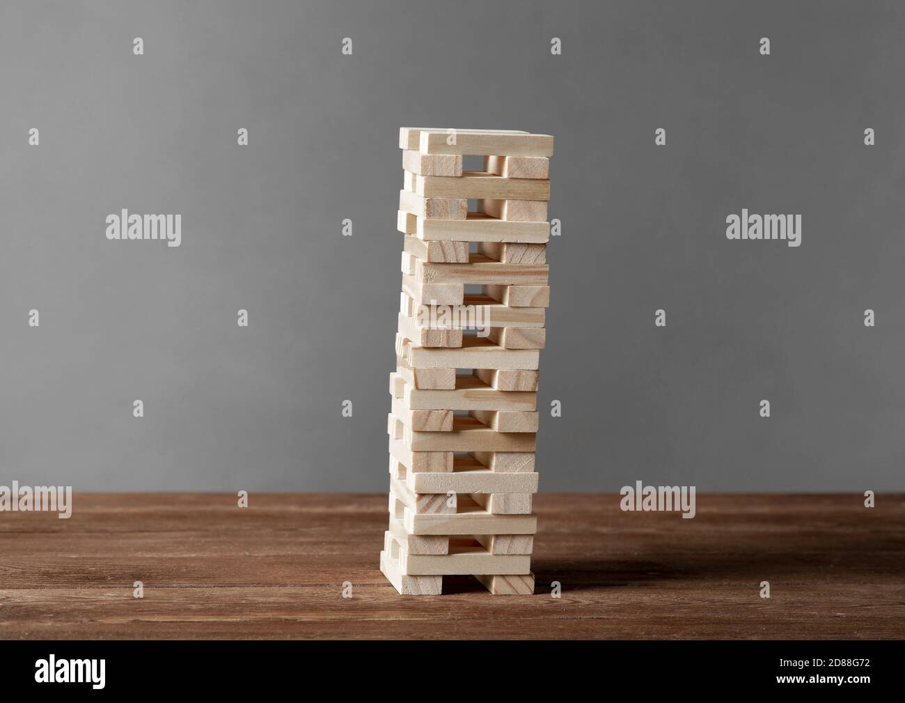 Tower from wooden blocks standing on table Stock Photo - Alamy