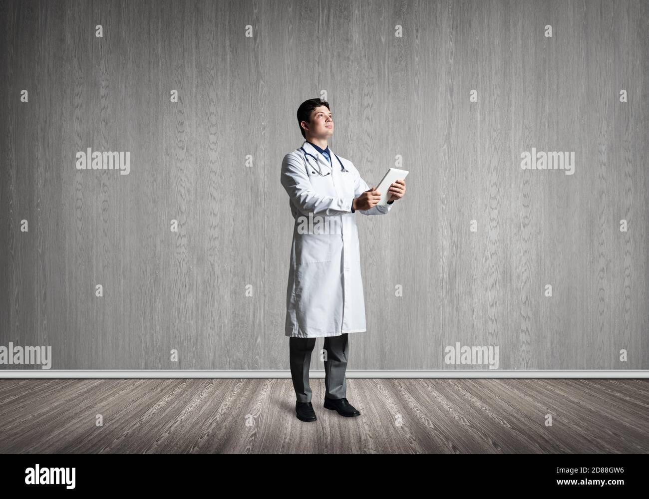 Doctor with tablet Stock Photo - Alamy