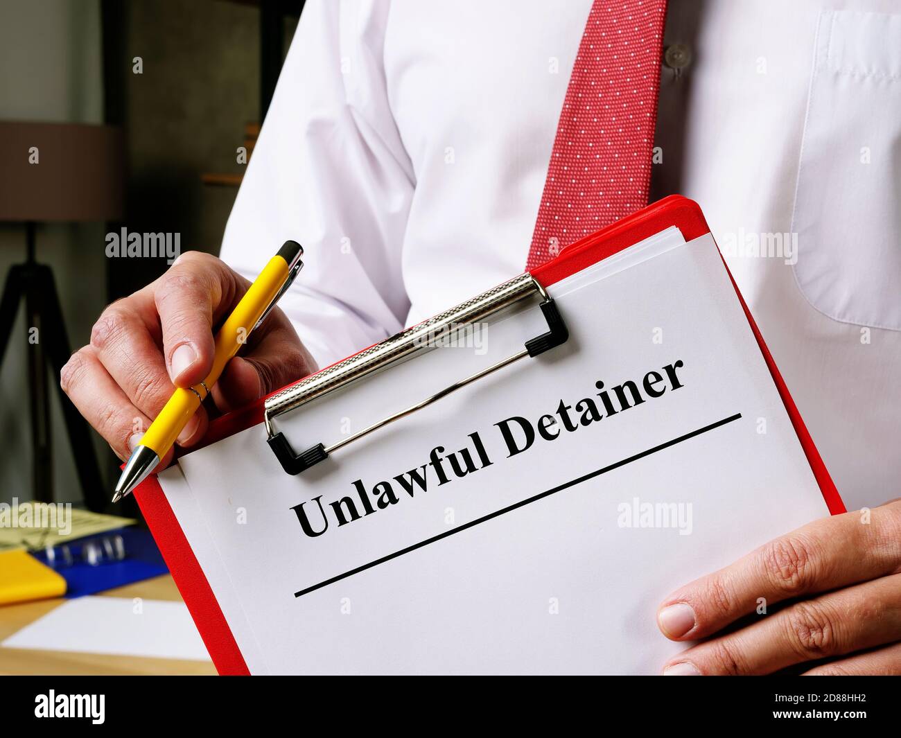 Unlawful detainer papers in the hands of man Stock Photo - Alamy
