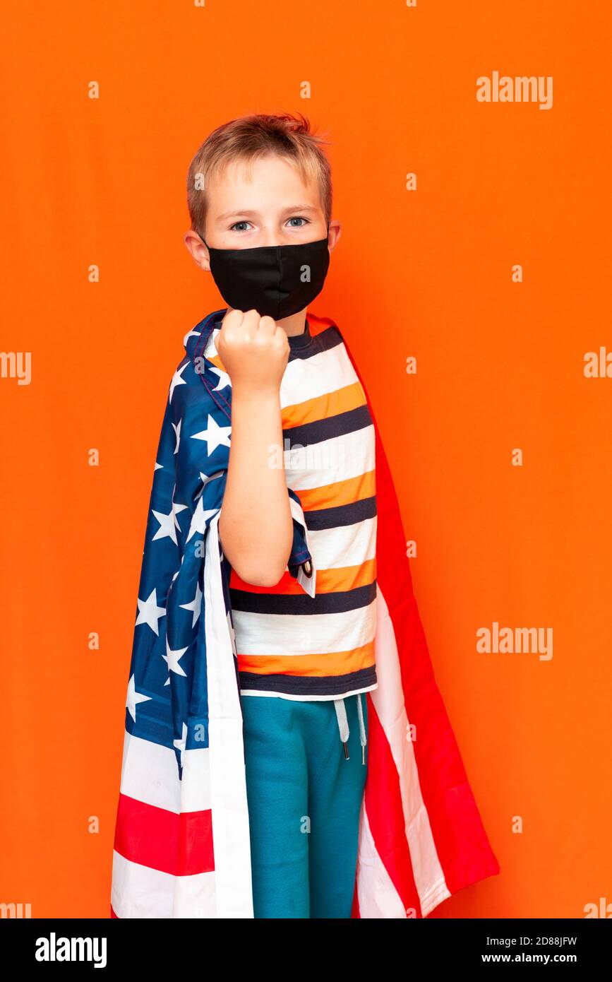 Calm boy wearing black face mask as a boxer on the shoulder usa flag on ...