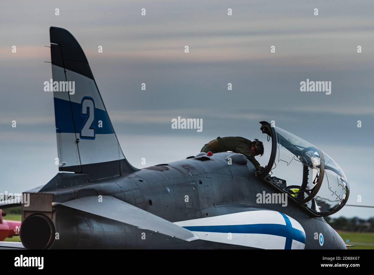 A pilot prepares his Finnish fighter plane before taking off. Finnish ...