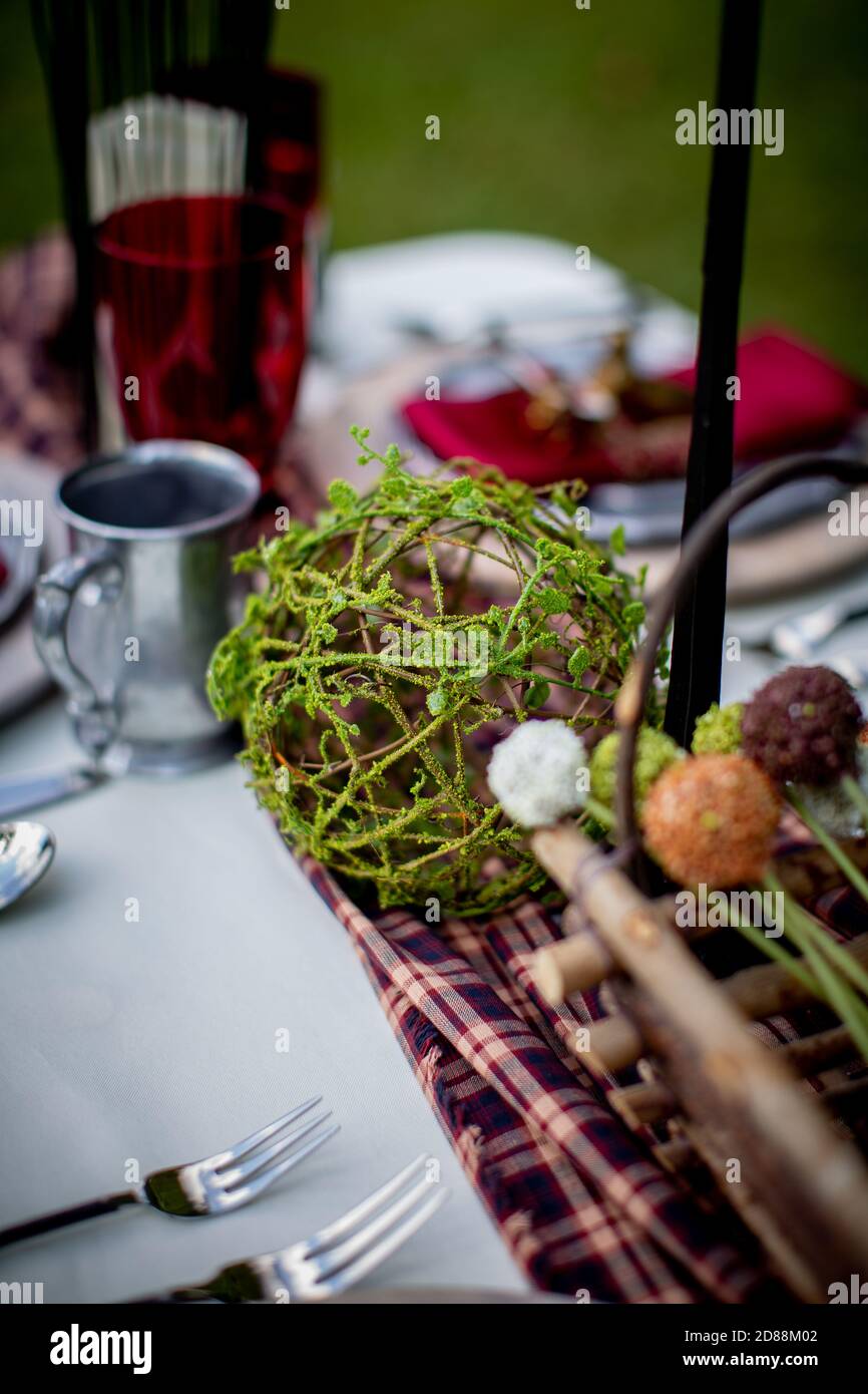 Scottish wedding table décor with green moss ball, silver cup and red ...