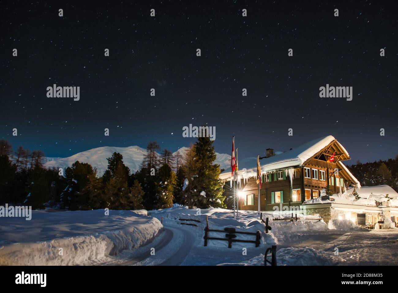 Mountain restaurant in the snow in the evening ready to welcome ...