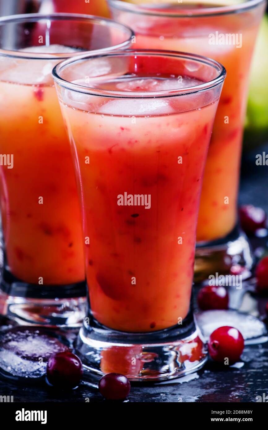 Alcoholic cocktail mango and cranberry liqueur with syrup, juice and ...