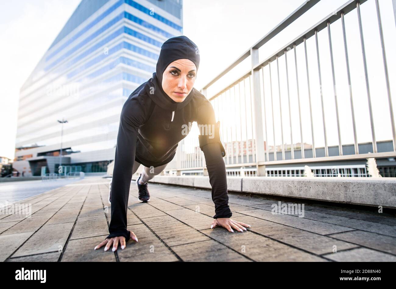 Muslim sportive girl with fit body training outside - Beautiful woman ...