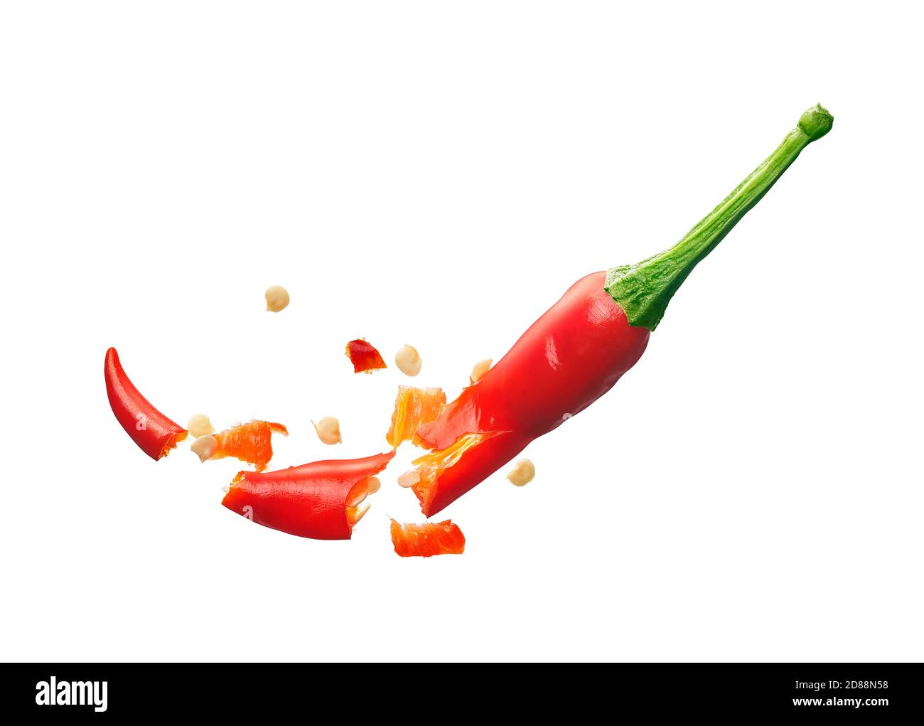 Red chili pepper crushed into pieces isolated on white background ...